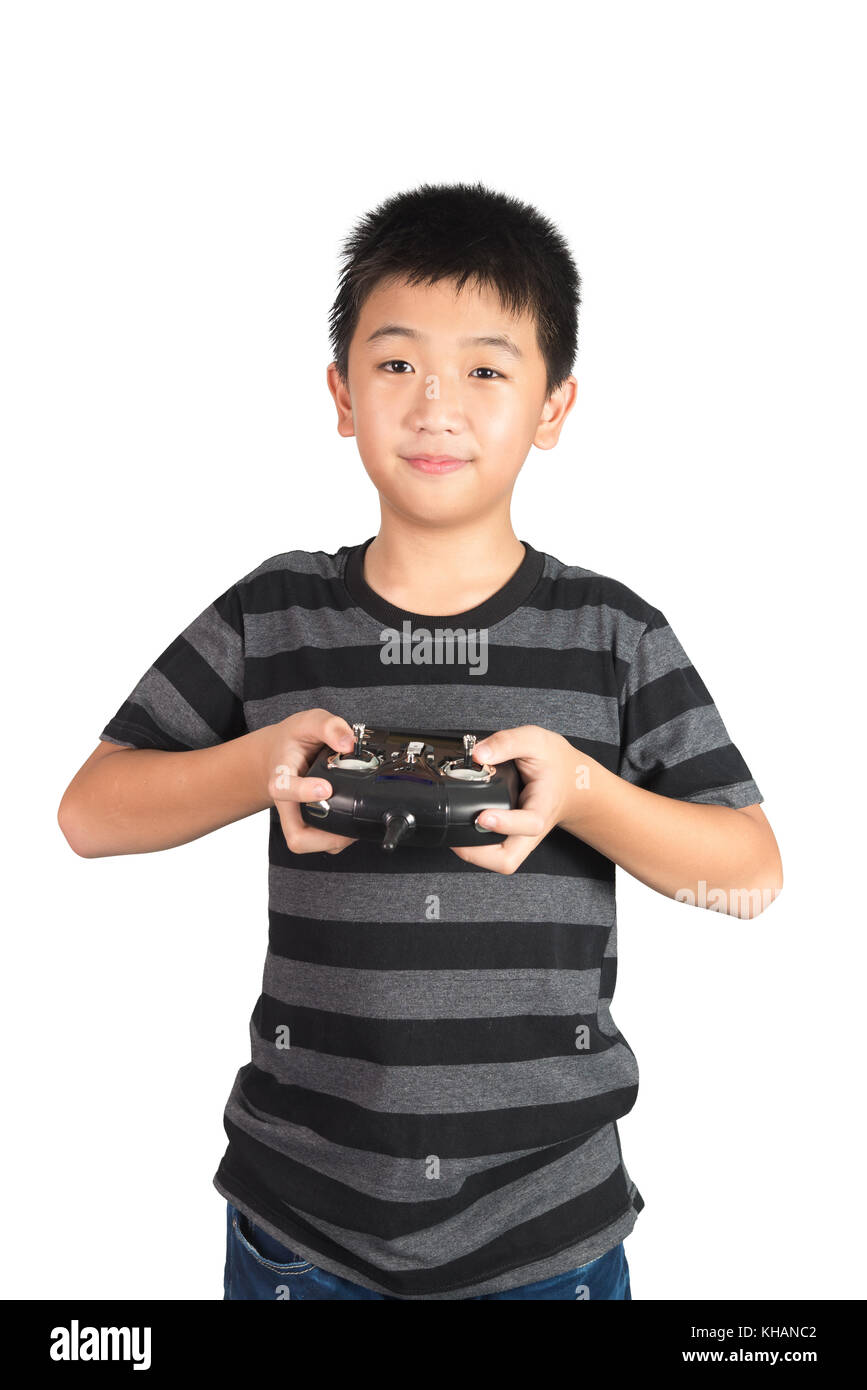 Asian boy holding radio remote control (controlling handset) for ...