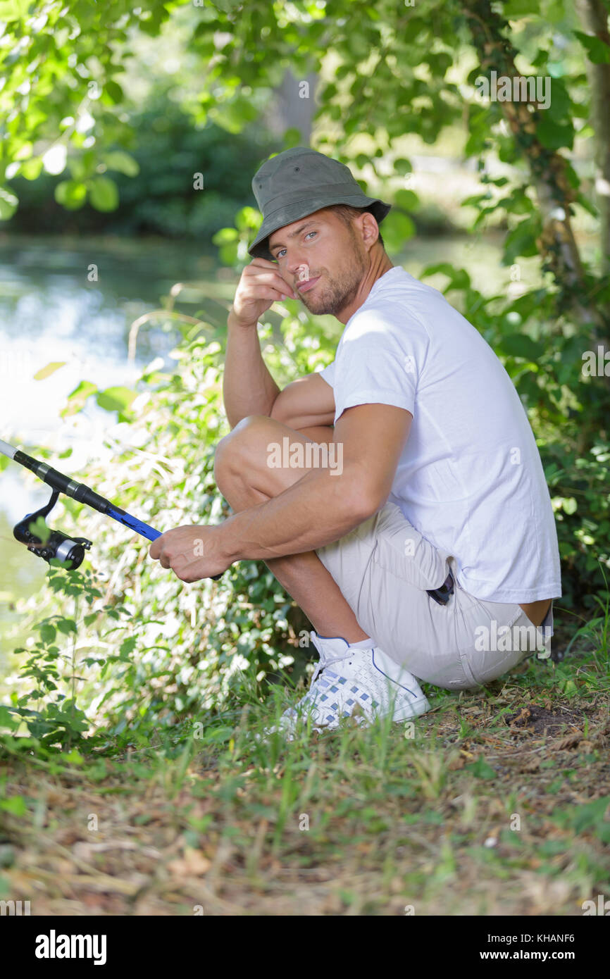 Alone man standing river pier hi-res stock photography and images - Alamy
