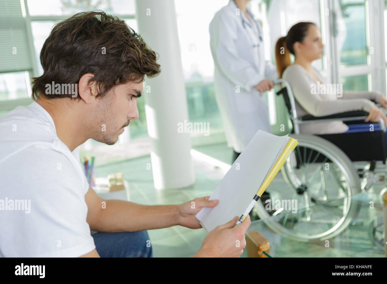 patients sitting in doctors waiting room Stock Photo - Alamy