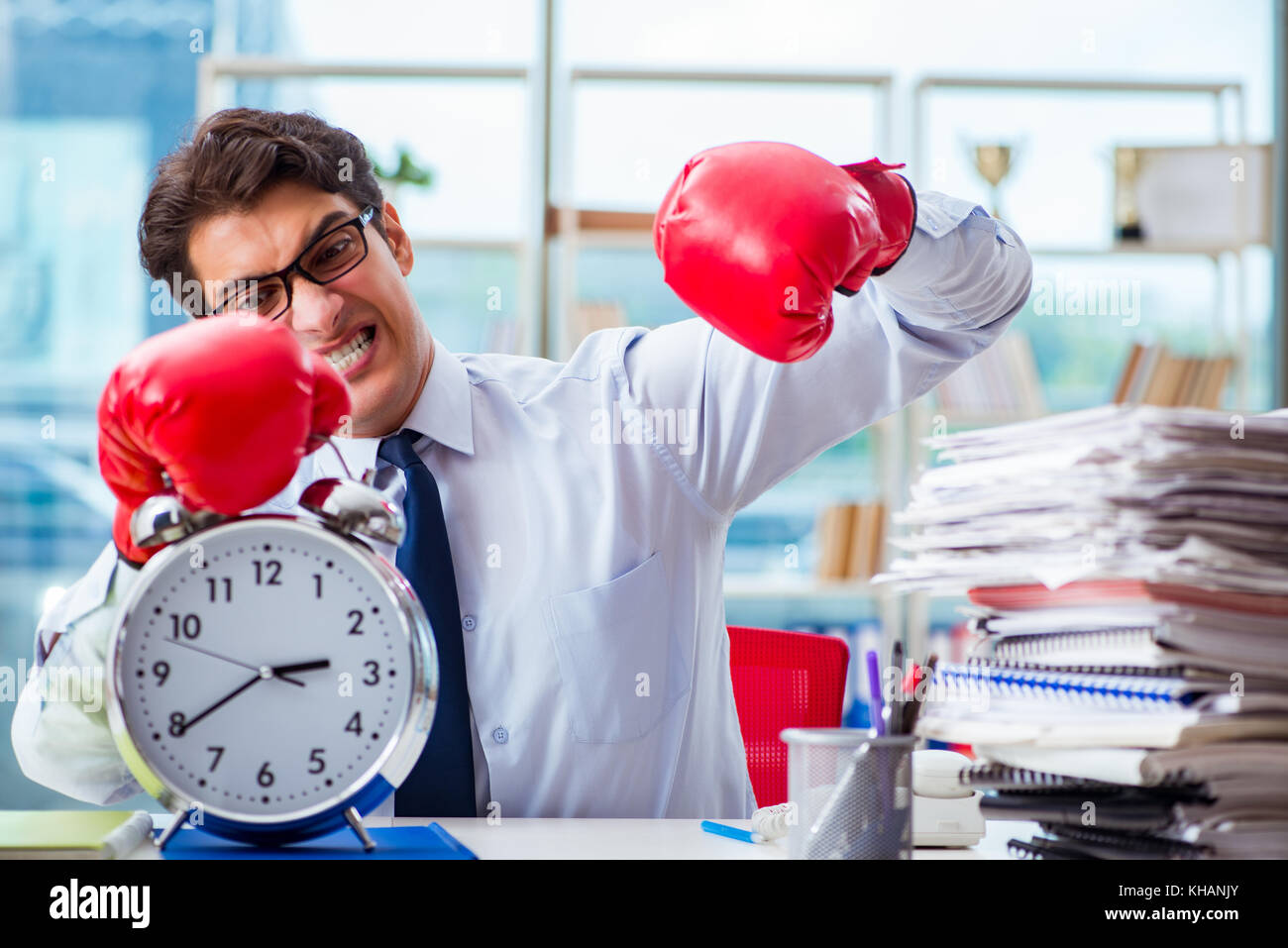 Businessman with boxing gloves in the office Stock Photo - Alamy