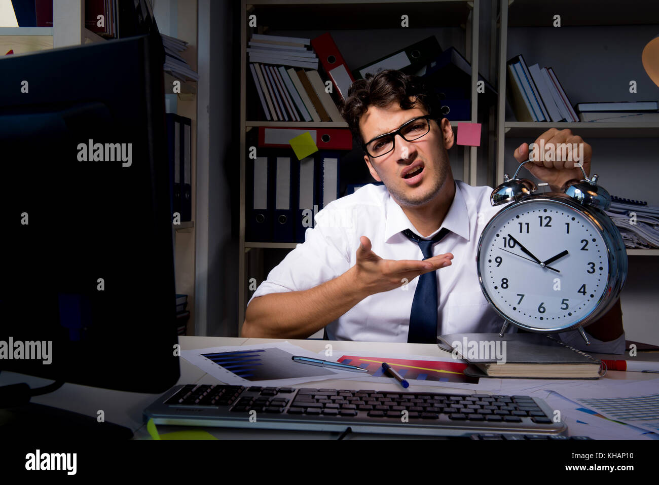 Man businessman working late hours in the office Stock Photo - Alamy