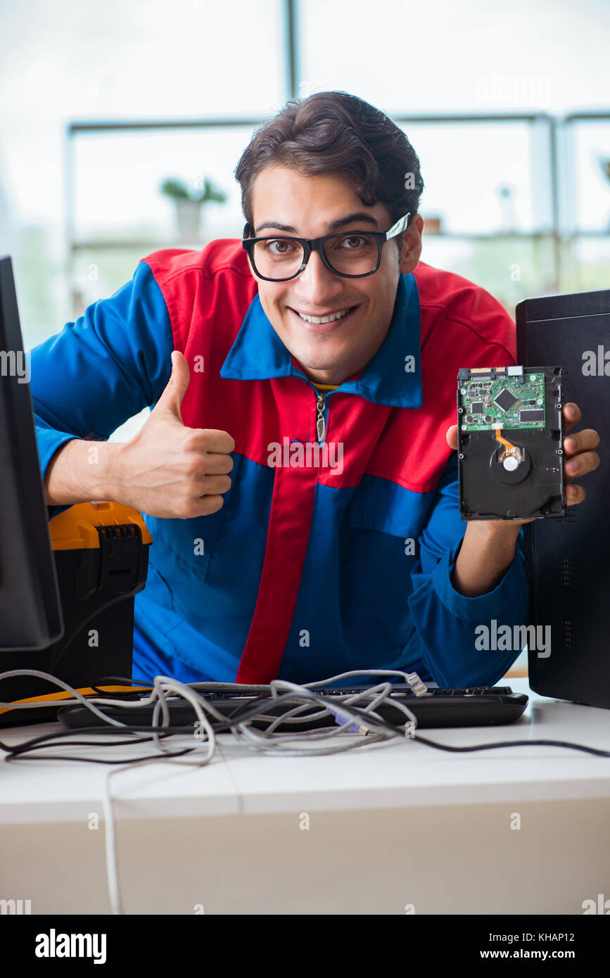 Computer repairman working on repairing computer in IT workshop Stock ...