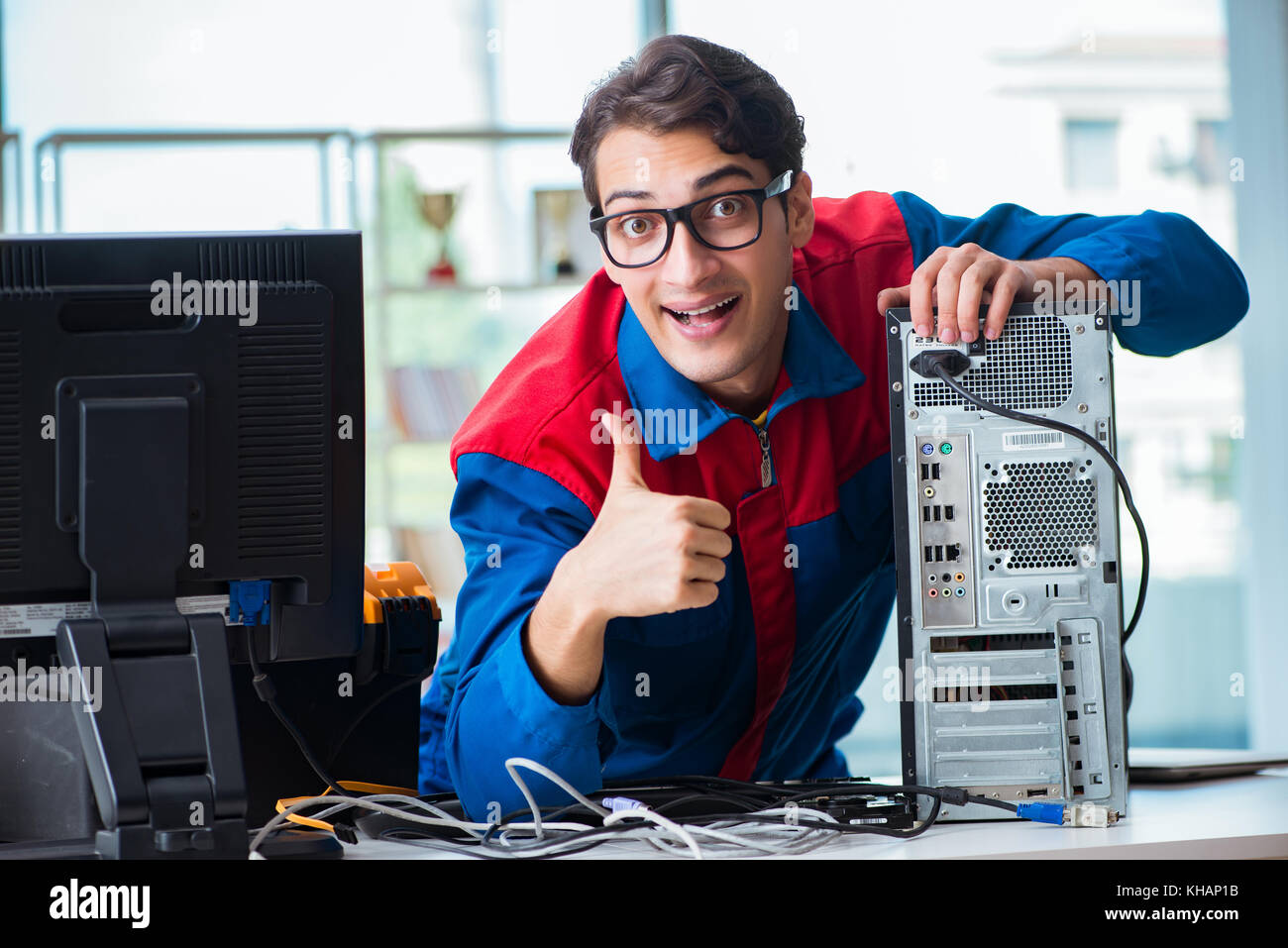 Computer repairman working on repairing computer in IT workshop Stock ...