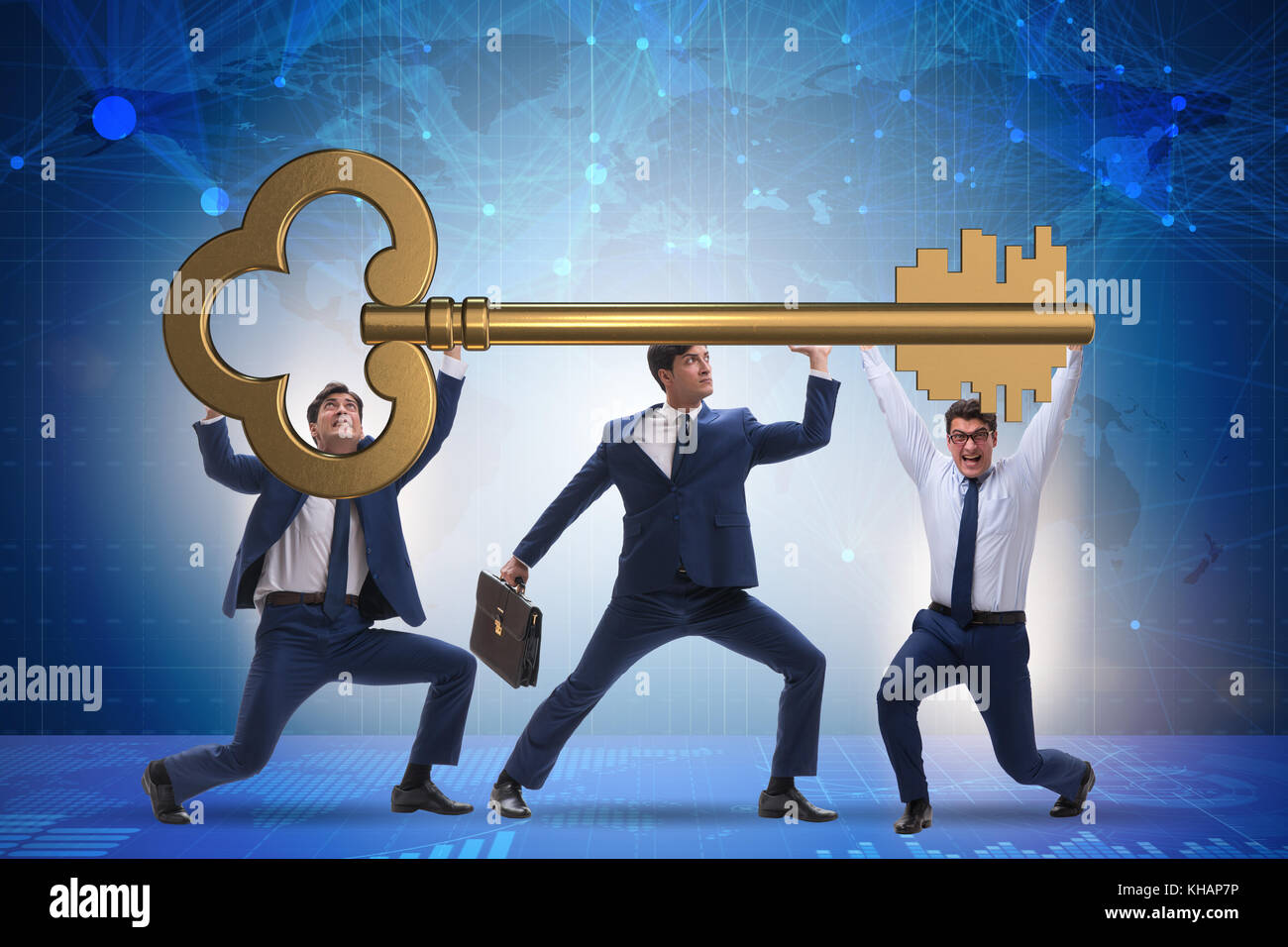 Businessmen holding giant key in business concept Stock Photo - Alamy