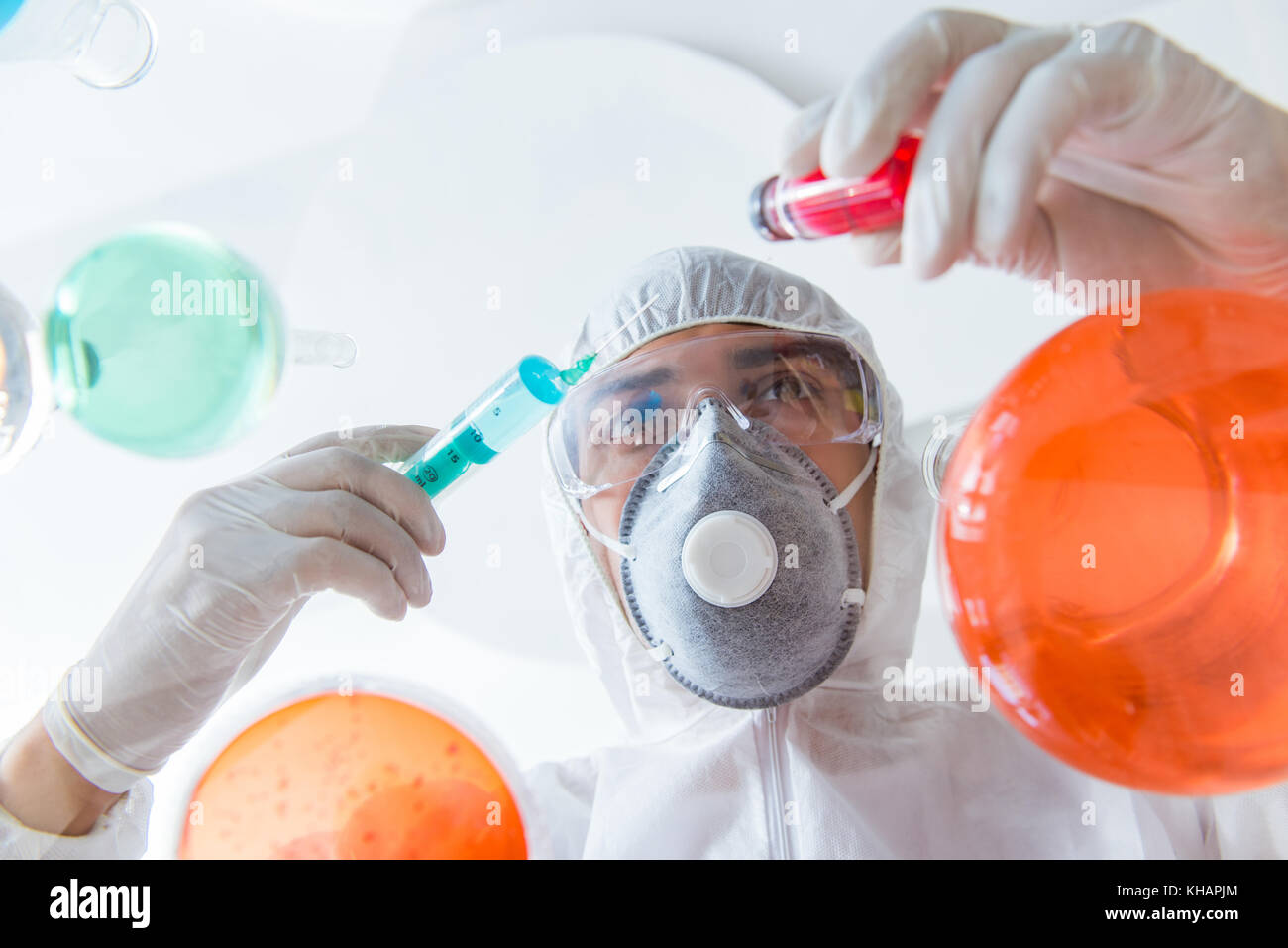 Chemist working in the laboratory with hazardous chemicals Stock Photo ...