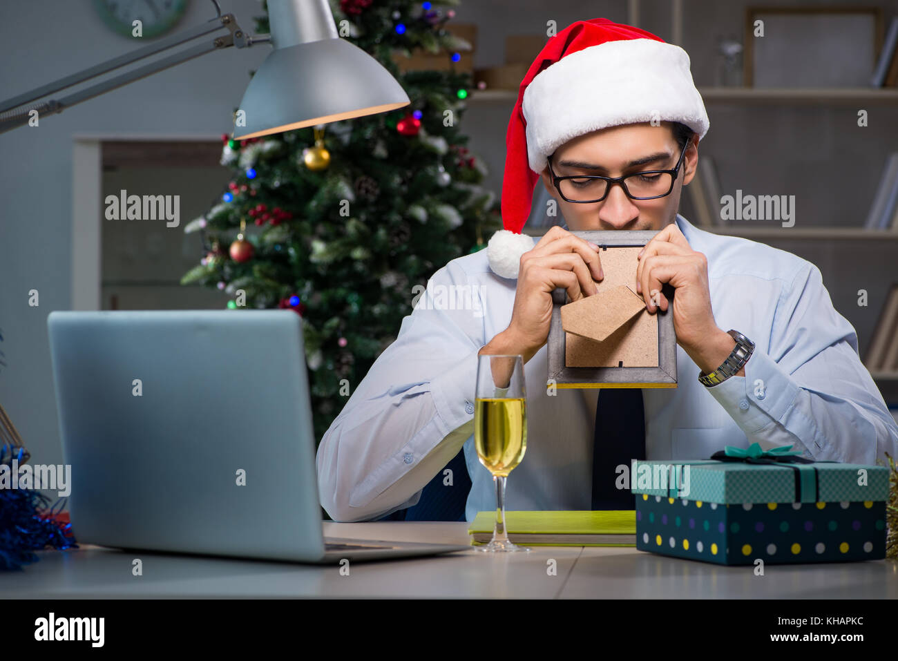 Businessman working late on christmas day in office Stock Photo - Alamy