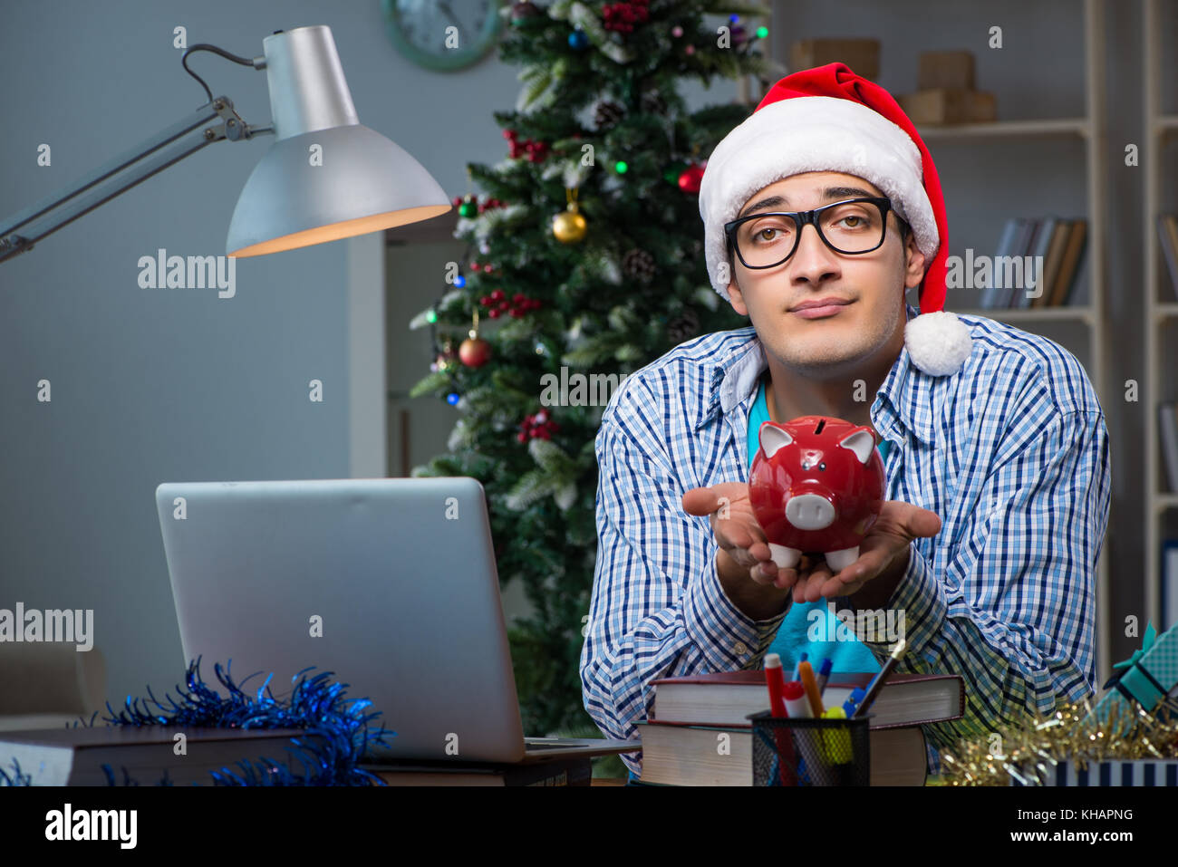 Young man working at home on christmas day Stock Photo - Alamy