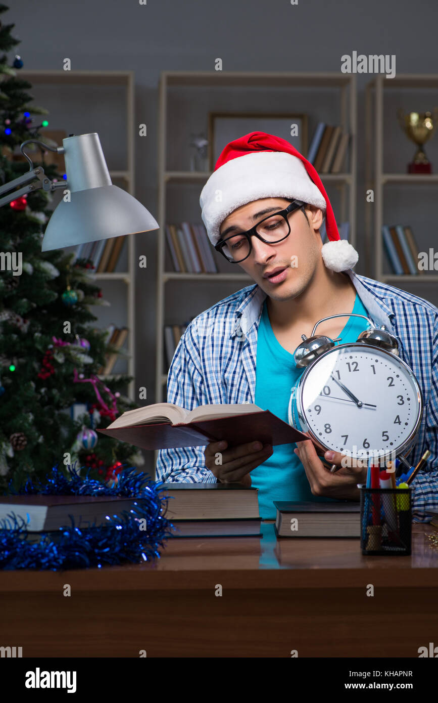 Young man working at home on christmas day Stock Photo - Alamy