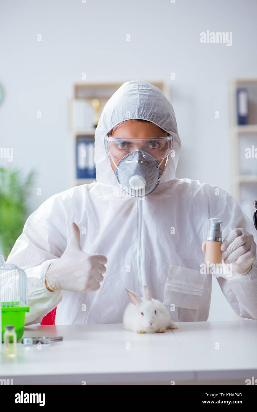 Scientist doing animal experiment in lab with rabbit Stock Photo - Alamy