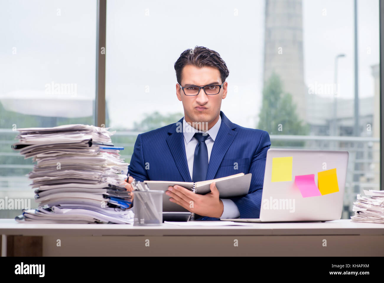 Workaholic businessman overworked with too much work in office Stock ...