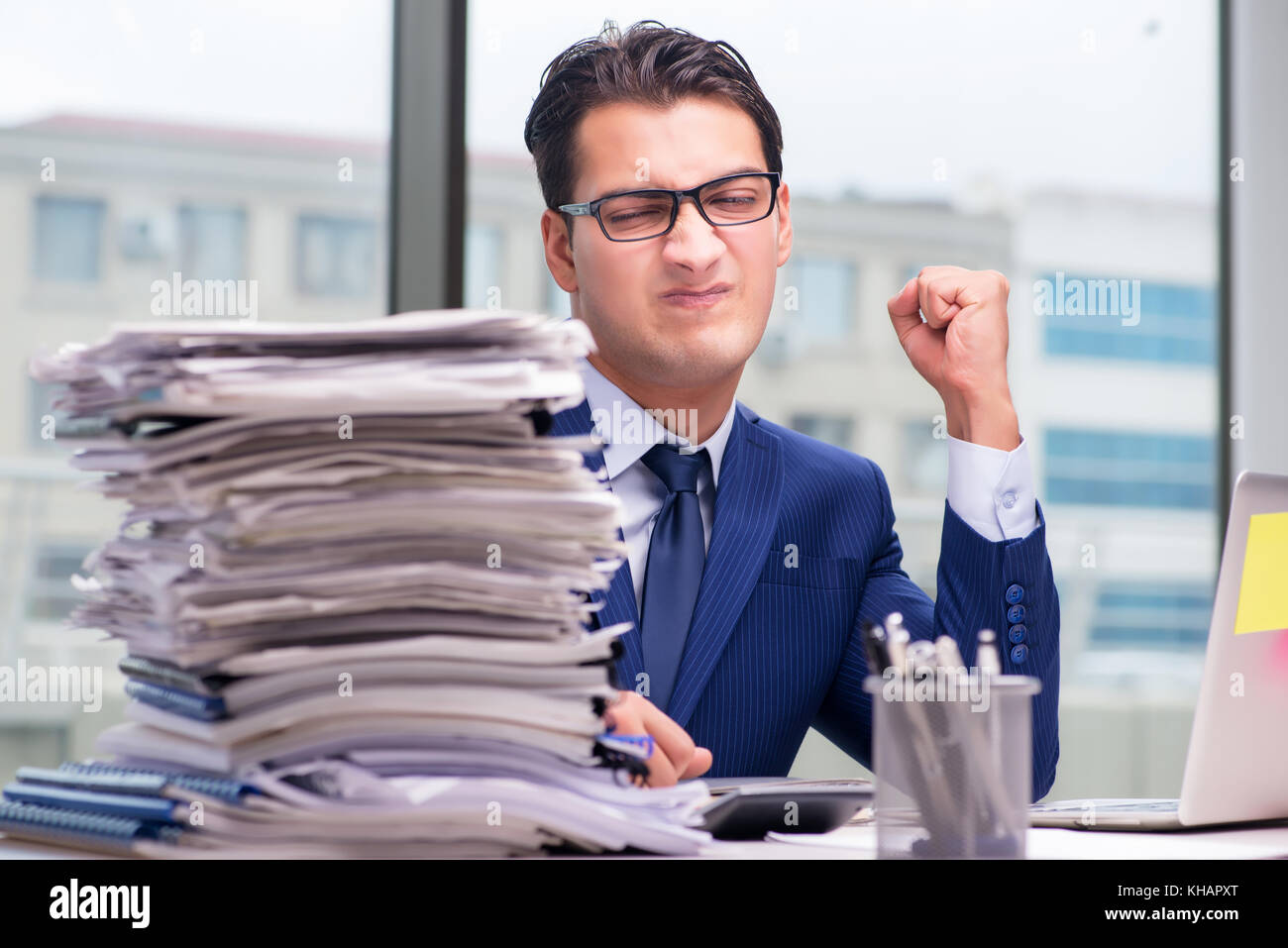 Workaholic businessman overworked with too much work in office Stock ...