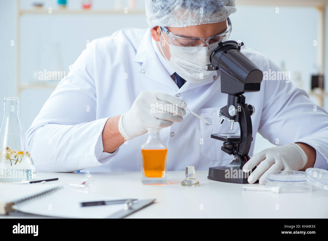 Chemist mixing perfumes in the lab Stock Photo - Alamy