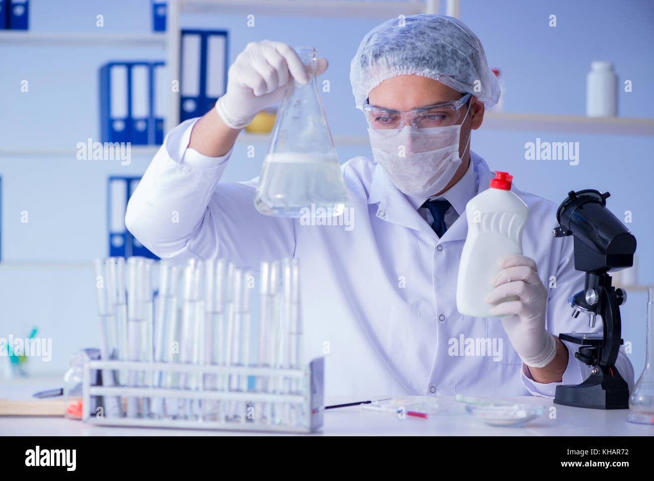 Man in the lab testing new cleaning solution detergent Stock Photo - Alamy