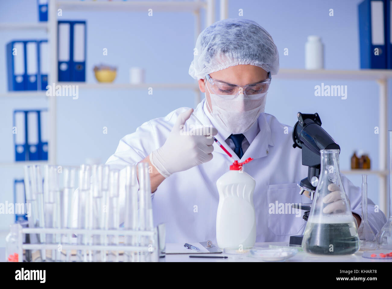Man in the lab testing new cleaning solution detergent Stock Photo - Alamy