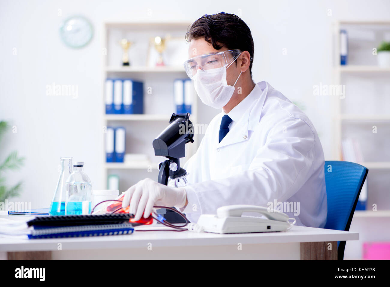 Doctor working with blood samples in hospital clinic lab Stock Photo ...