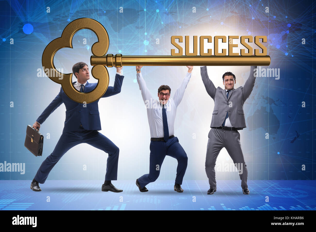 Businessmen holding giant key in business concept Stock Photo - Alamy