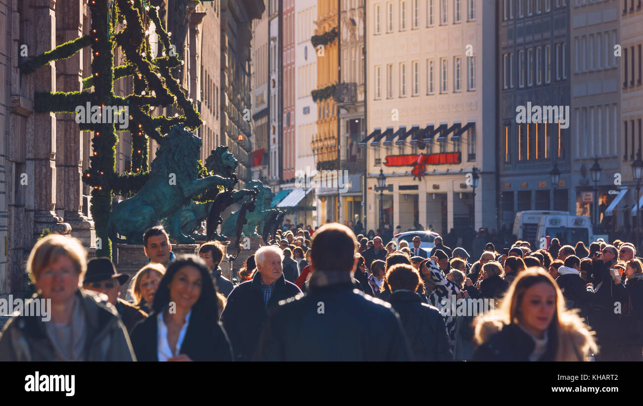 pedestrians walk through the city center Stock Photo - Alamy