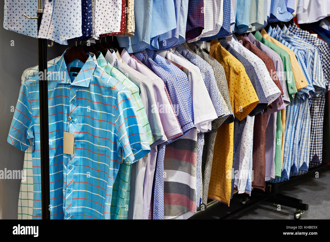 Men's shirts with short sleeves in the clothing store Stock Photo - Alamy