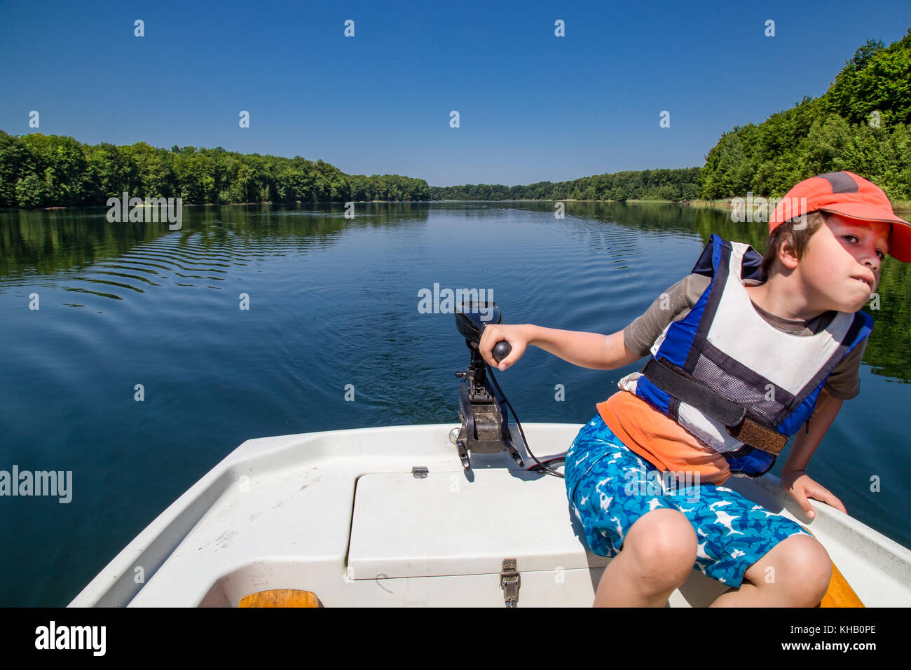 Boy Driving Boat High Resolution Stock Photography and Images - Alamy