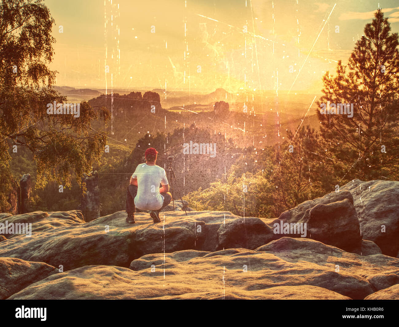 Flare, soft focus. Nature photographer takes photos on peak. A mirror ...