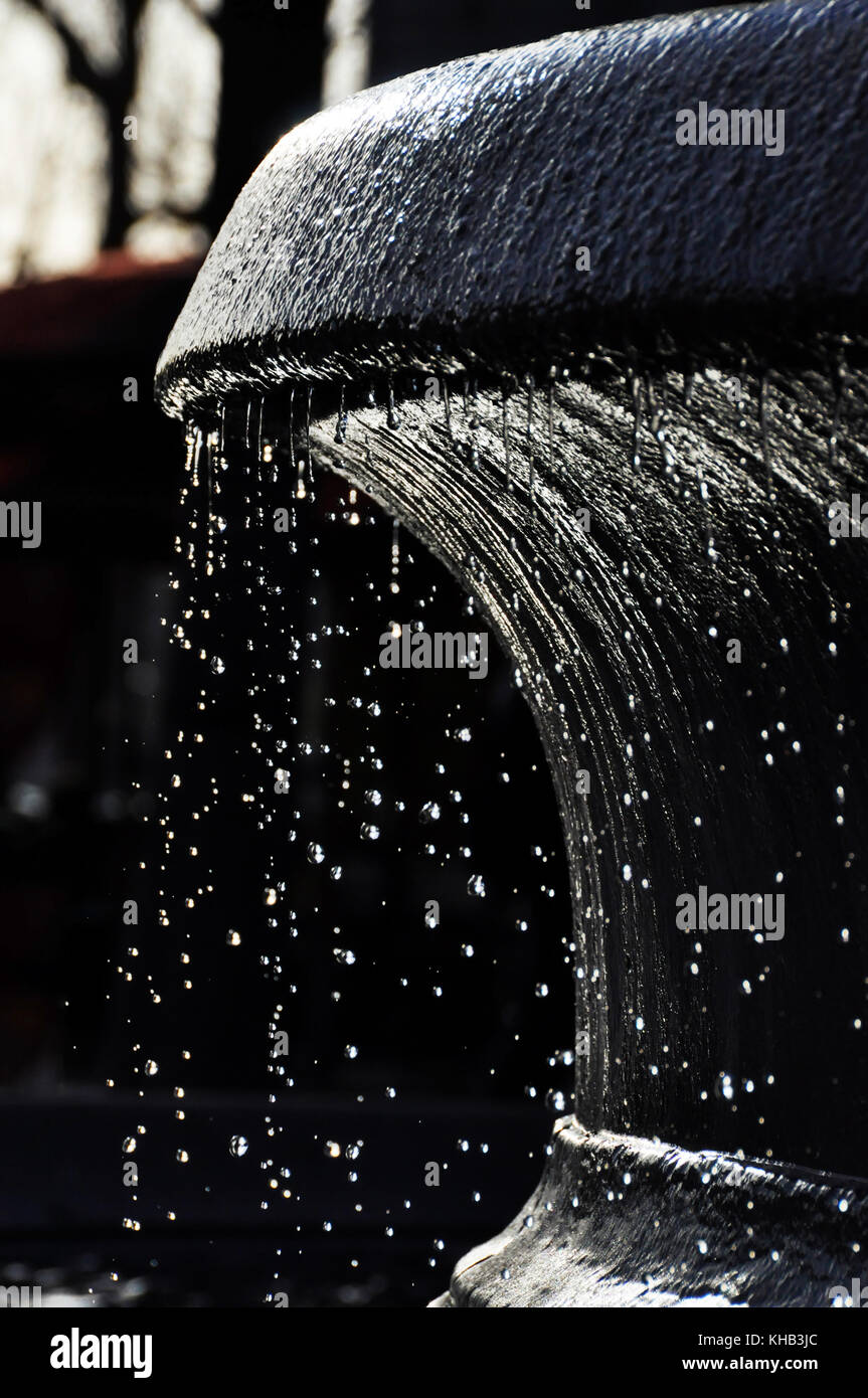 Backlit fountain in Paris, France. High shutter speed to freeze the ...