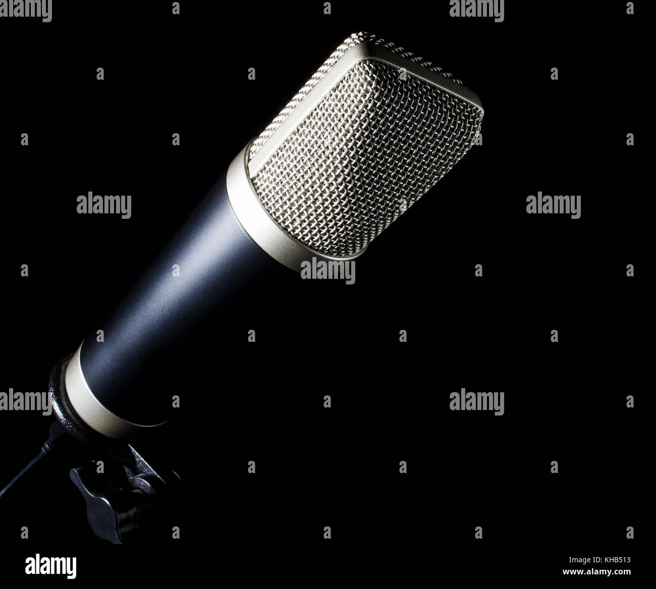Microphone with a wire mesh screen on a black background Stock Photo ...
