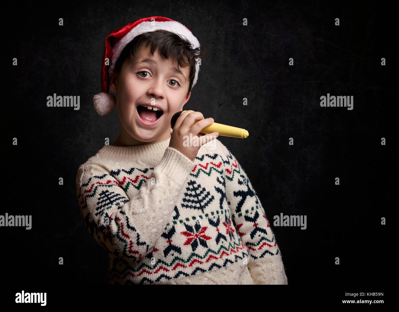 child singing Christmas carol at Christmas Stock Photo - Alamy
