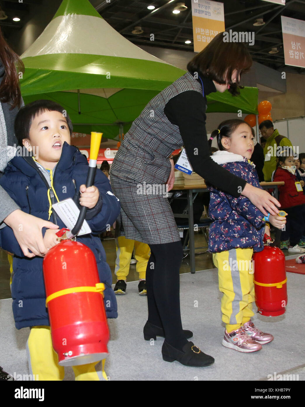 15th Nov, 2017. Fire suppression Children practice using fire ...