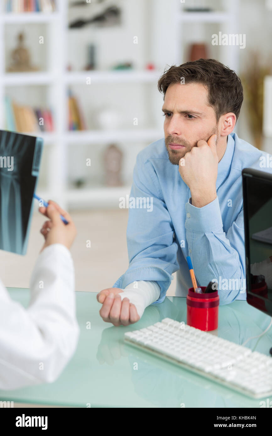young patient during consultation in doctors office Stock Photo - Alamy