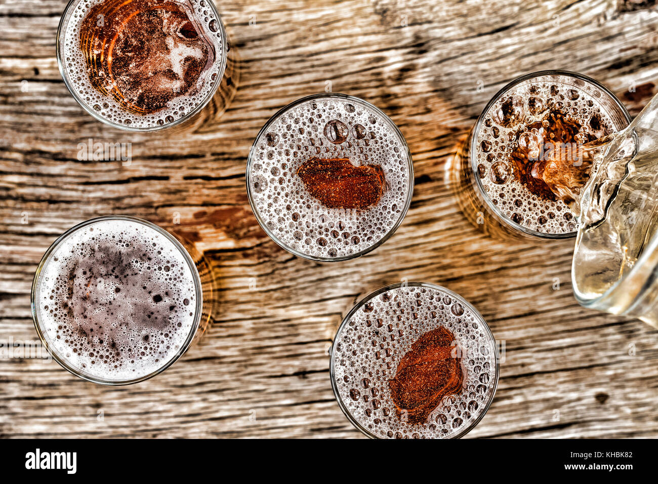 Pouring beer. View from above. Closeup wooden background Stock Photo ...