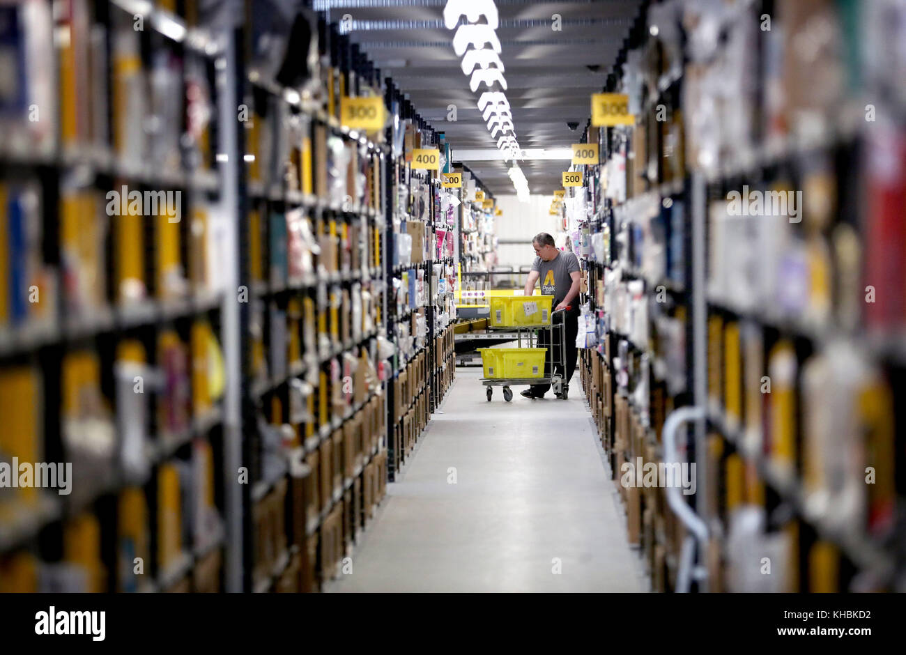 Staff make their way around the aisles collecting items before sending ...