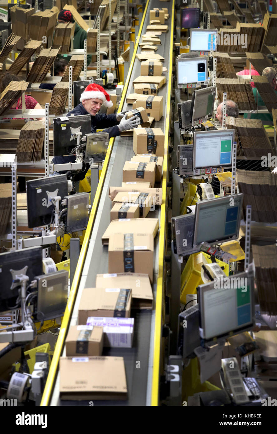 Embargoed to 0001 Thursday November 16 Staff label and package items in ...