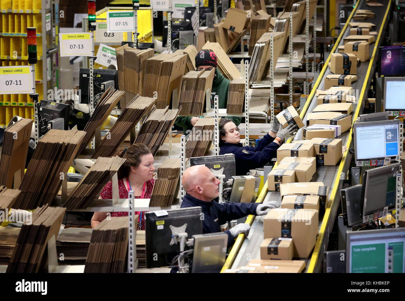 Embargoed to 0001 Thursday November 16 Staff label and package items in ...