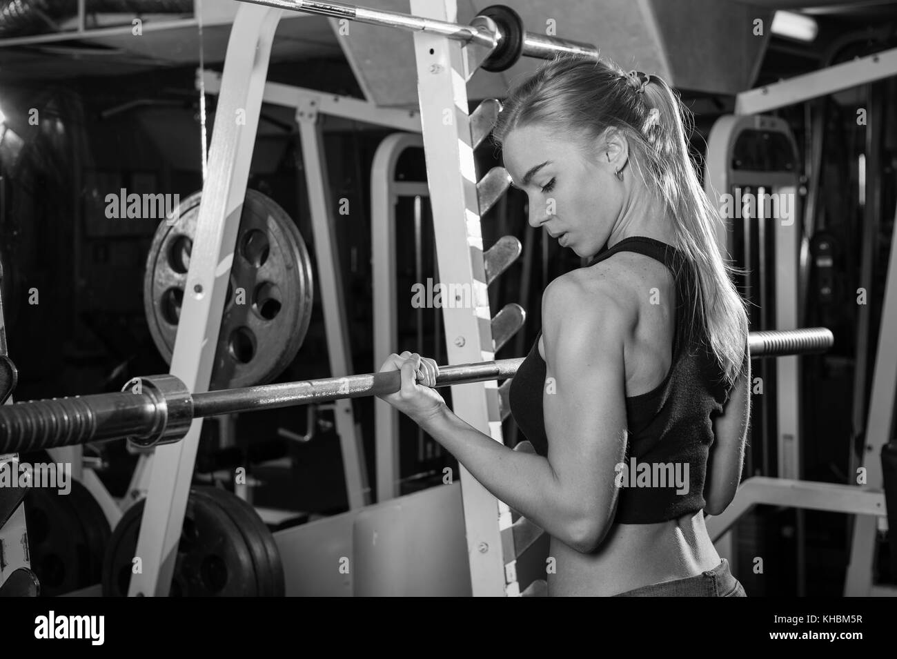 Young muscular woman doing workout Stock Photo - Alamy