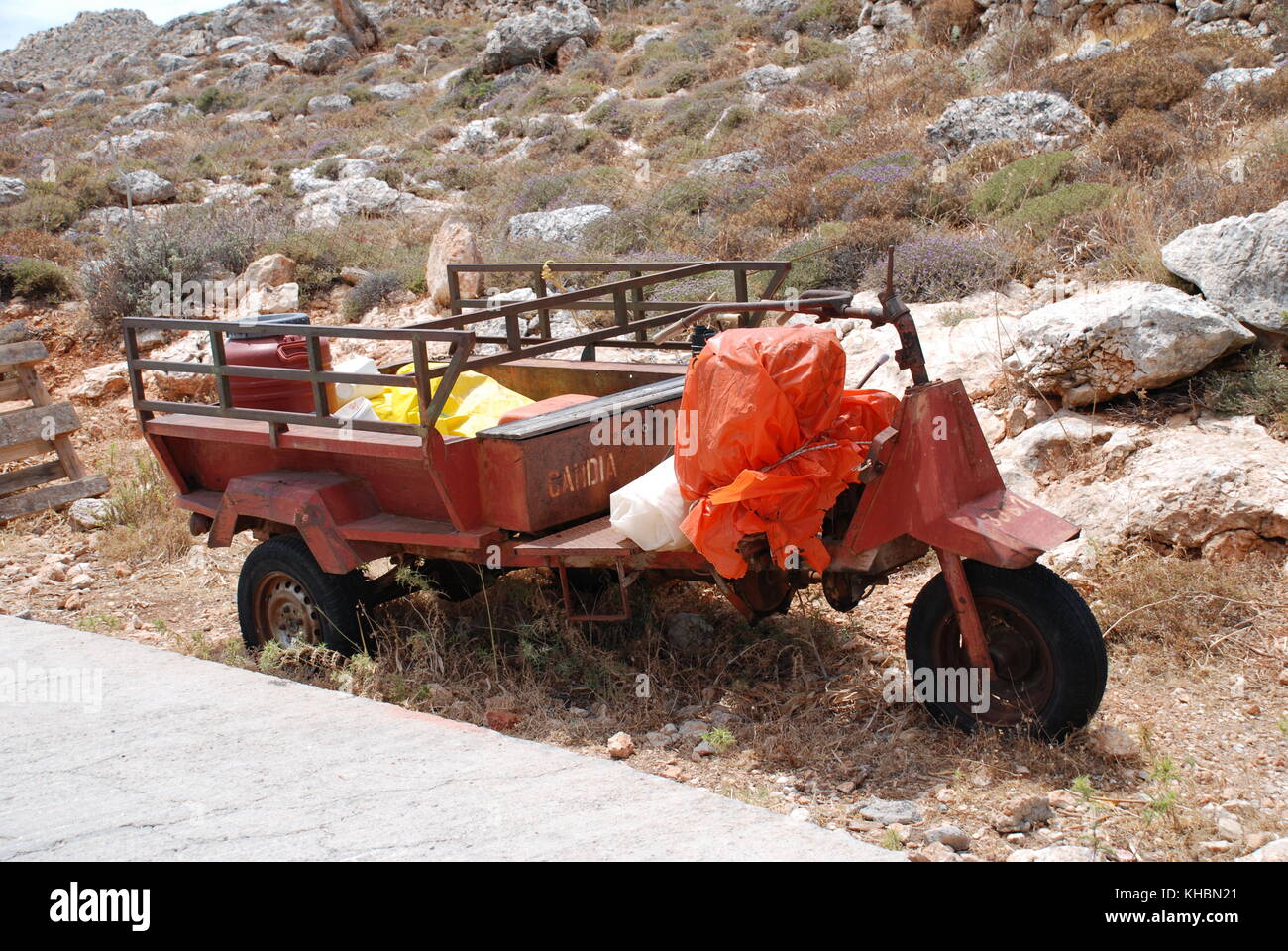 An old three wheeled tractor and trailer at the road side near Kania on ...