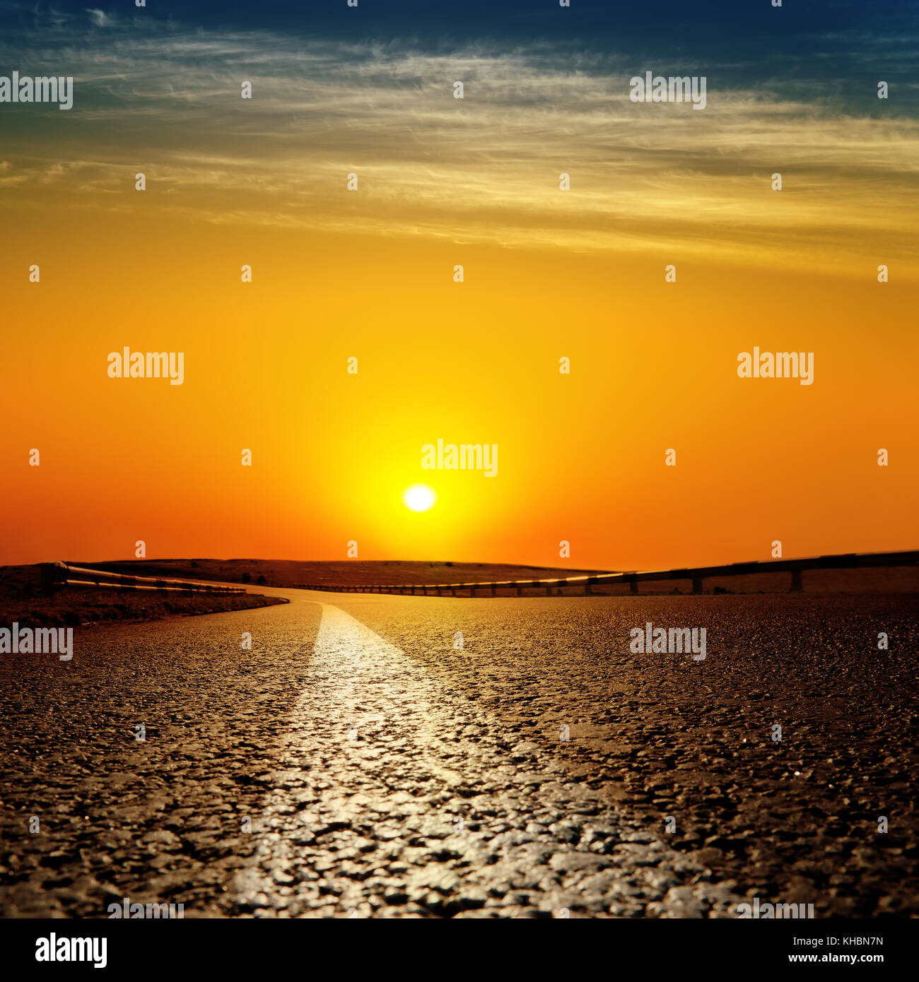 asphalt road to red sunset Stock Photo - Alamy