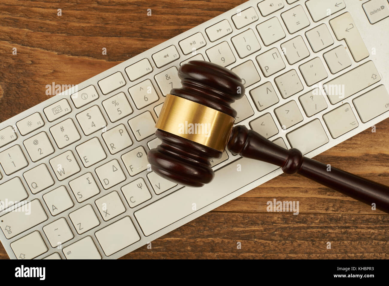 Judge gavel on computer keyboard Stock Photo - Alamy