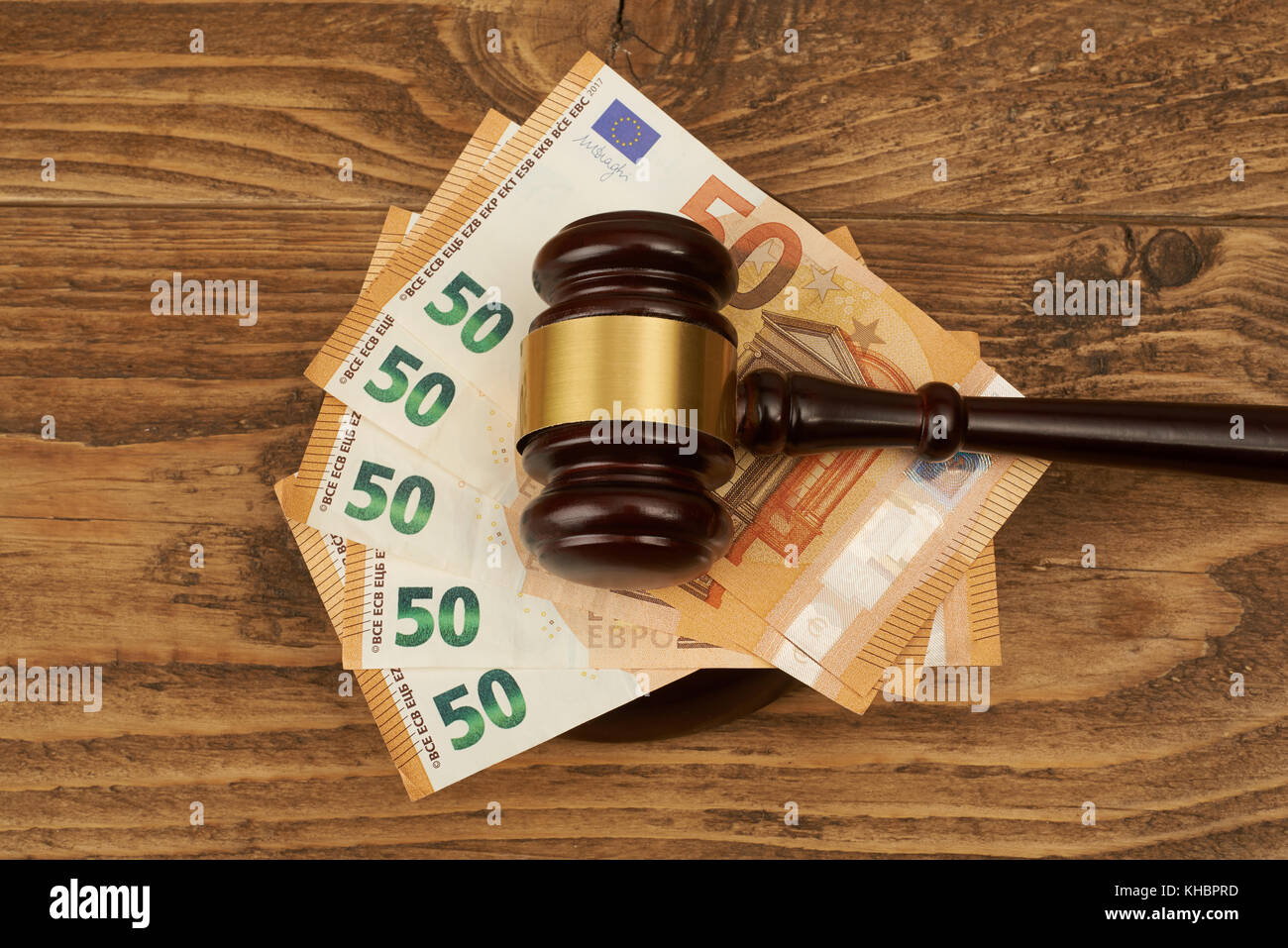 Judge gavel and money stack on wooden table Stock Photo - Alamy