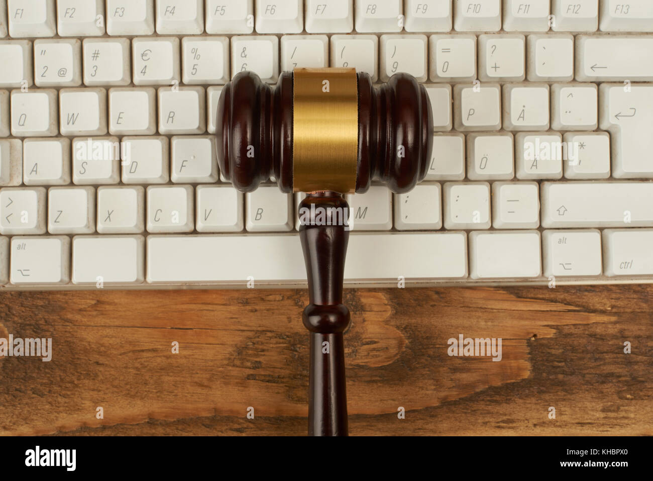 Judge gavel on computer keyboard Stock Photo - Alamy