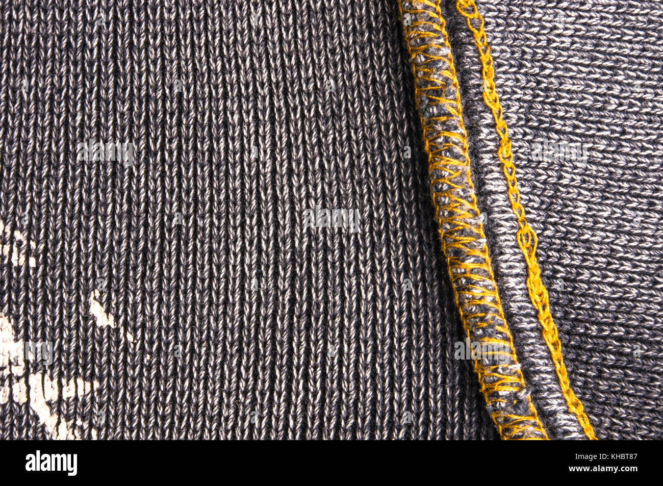 texture of a washed thick knit fabric, with decorative elements, seams ...