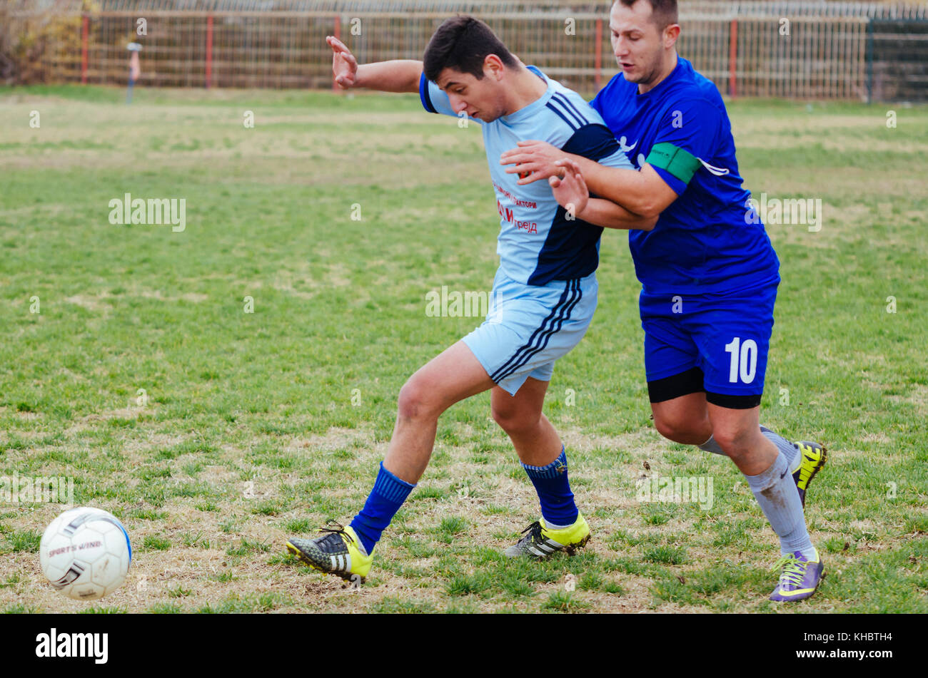 Men's are playing outdoor football match Stock Photo - Alamy