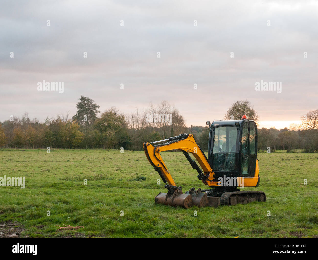 industry construction environment yellow digger machine parked outside ...