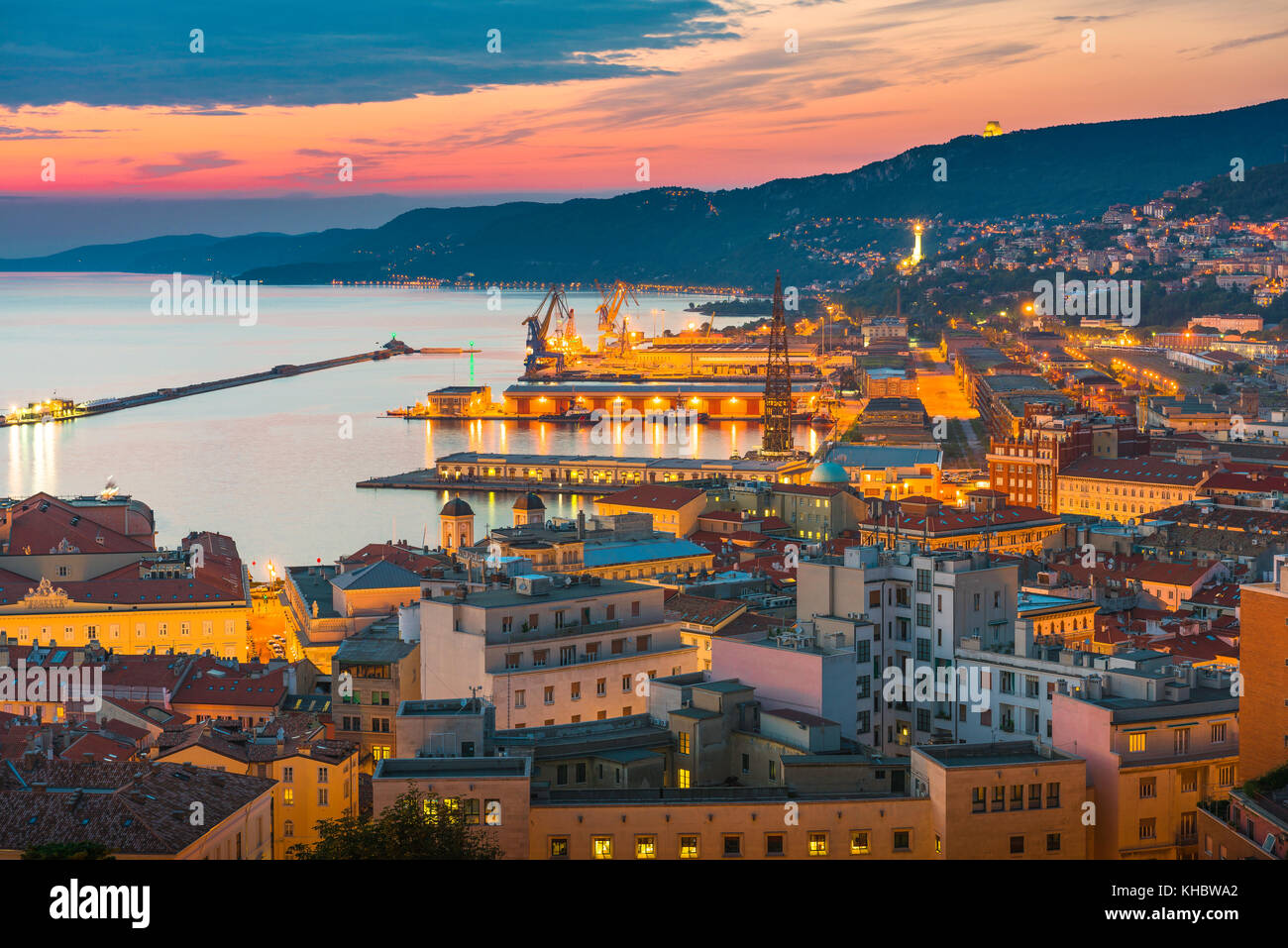 Trieste Italy city, aerial view of the illuminated port area of Trieste ...