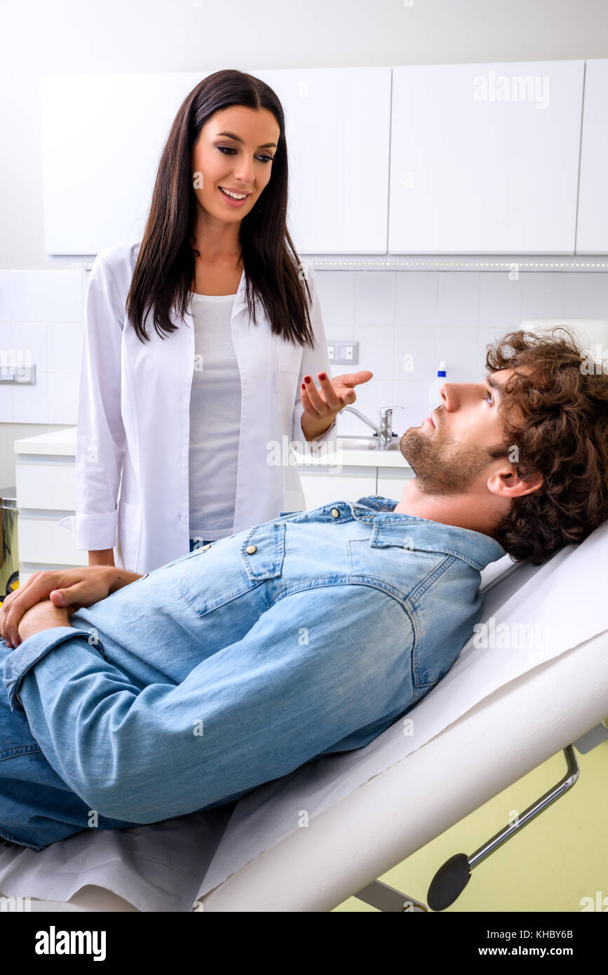 A young male patient in the hospital room with a doctor Stock Photo - Alamy
