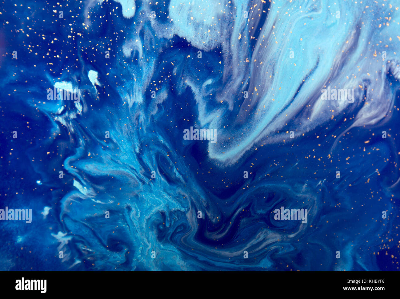 Marbled blue abstract background with golden sequins. Liquid marble ink ...