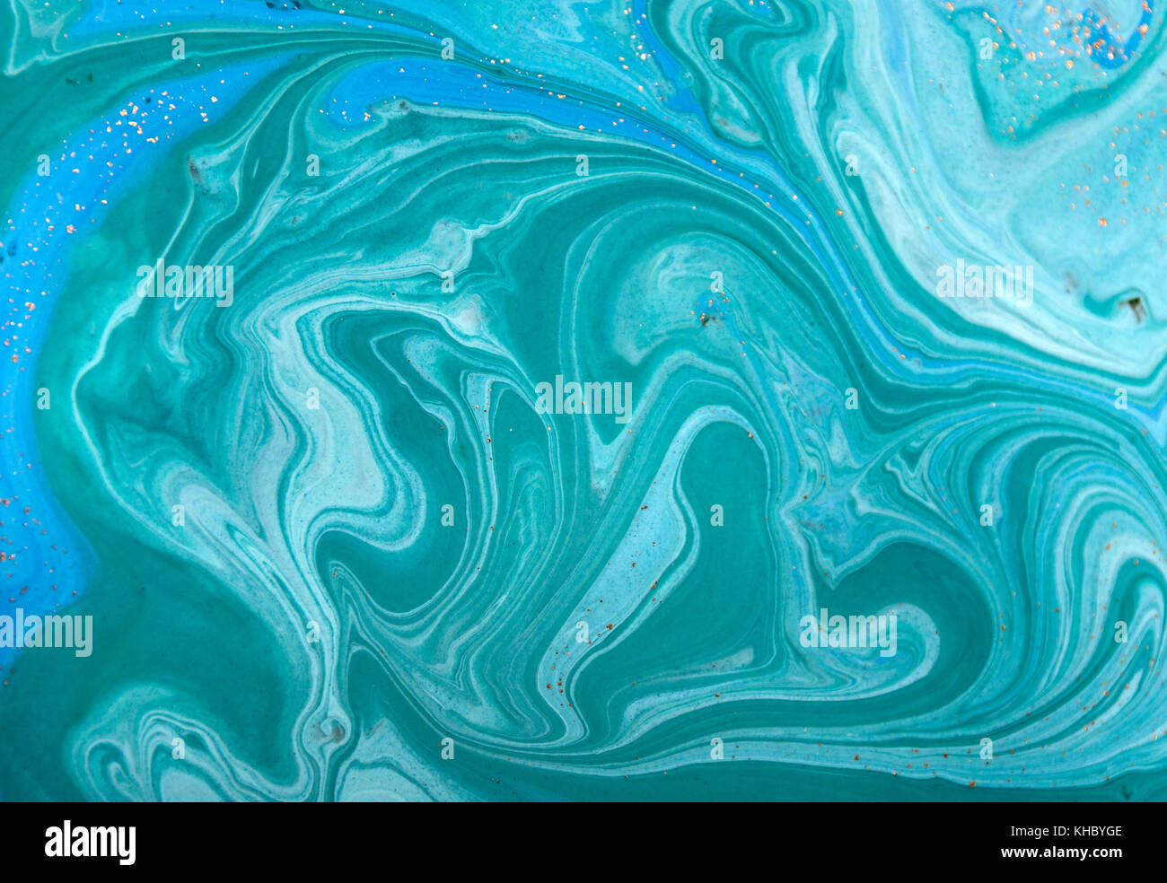 Marbled blue abstract background with golden sequins. Liquid marble ink ...