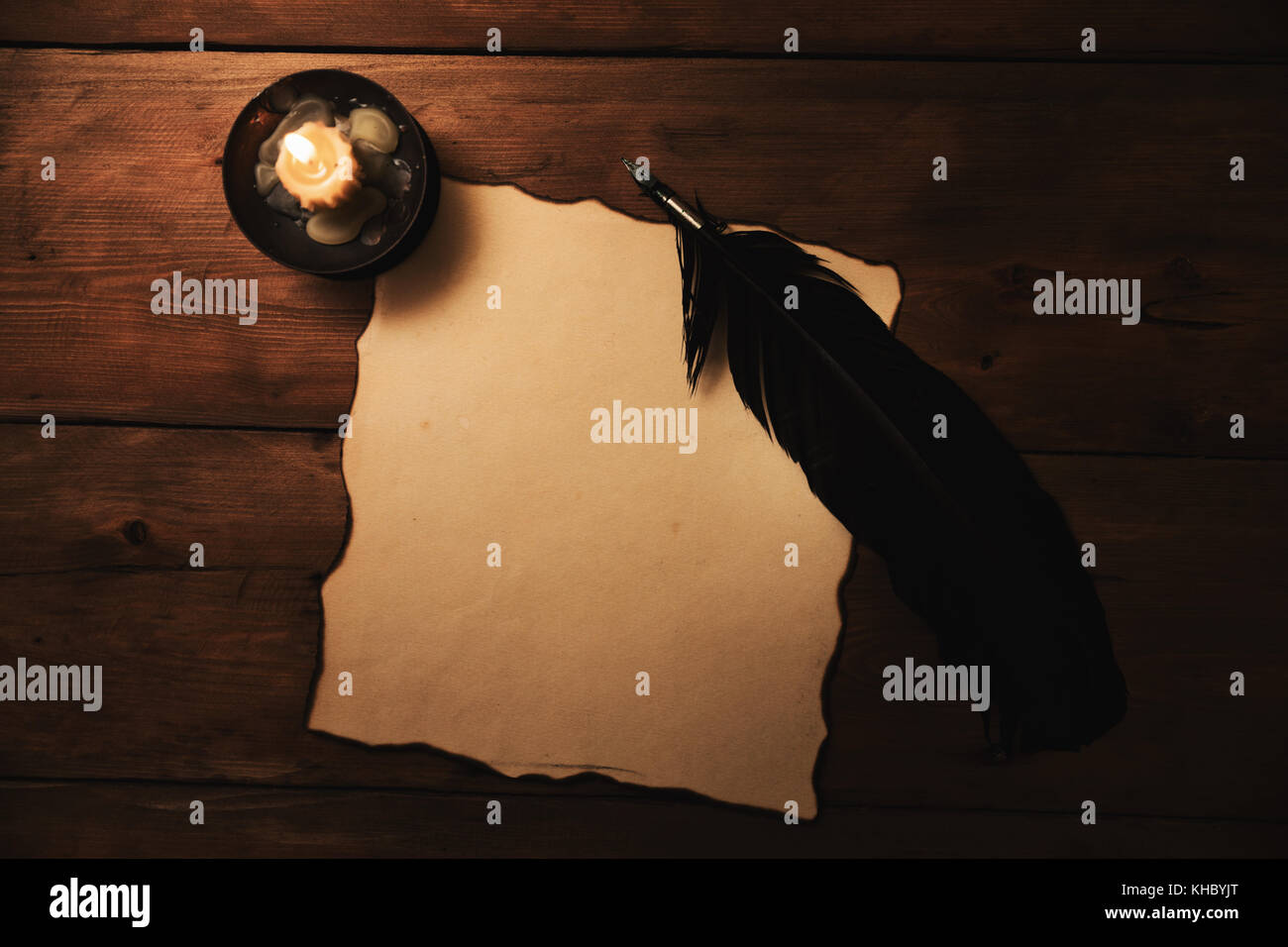 old paper and quill pen in candlelight. top view Stock Photo - Alamy