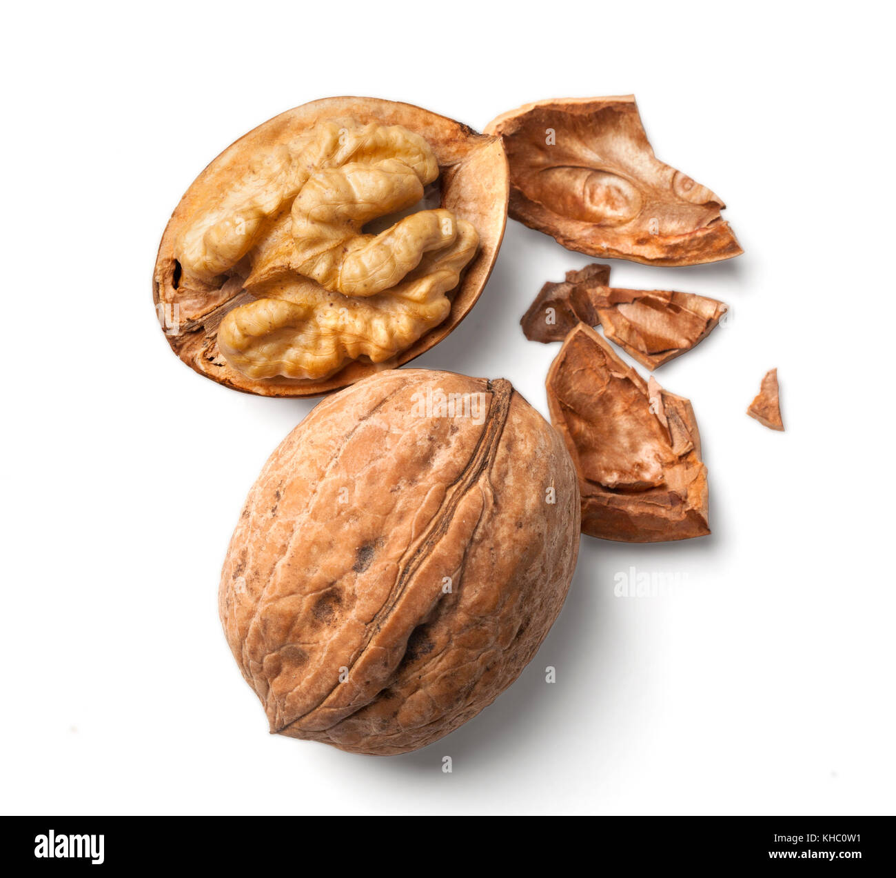 walnut and a cracked walnut isolated on the white background with ...