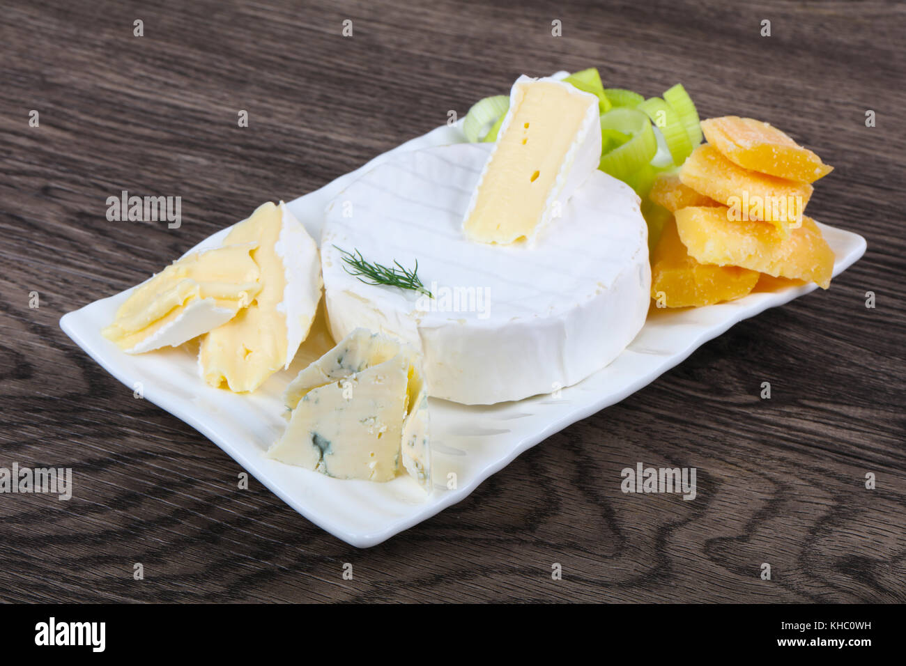 Cheese platter with brie, blue and parmesan Stock Photo - Alamy