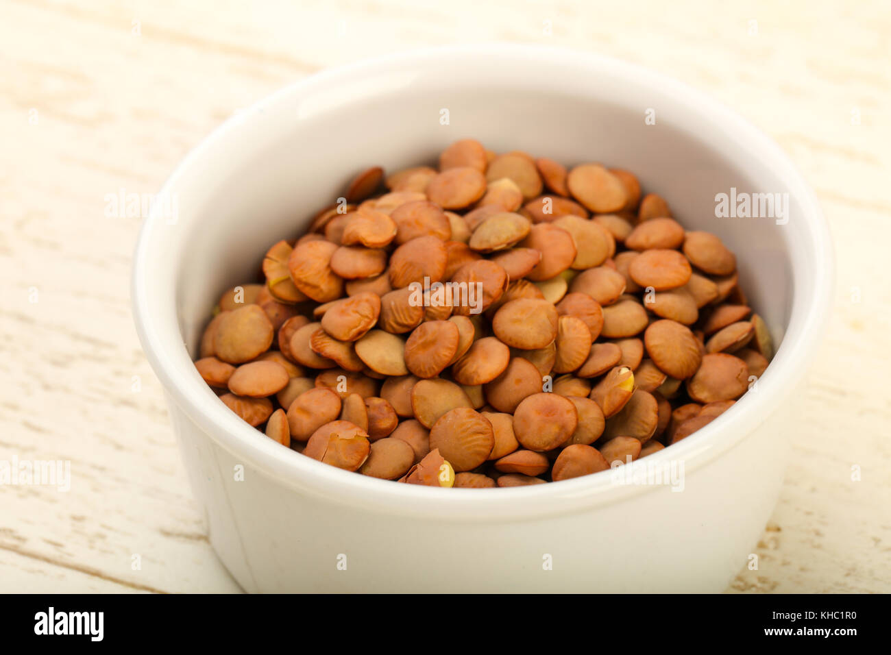 Raw lentils in the bowl ready for cooking Stock Photo - Alamy